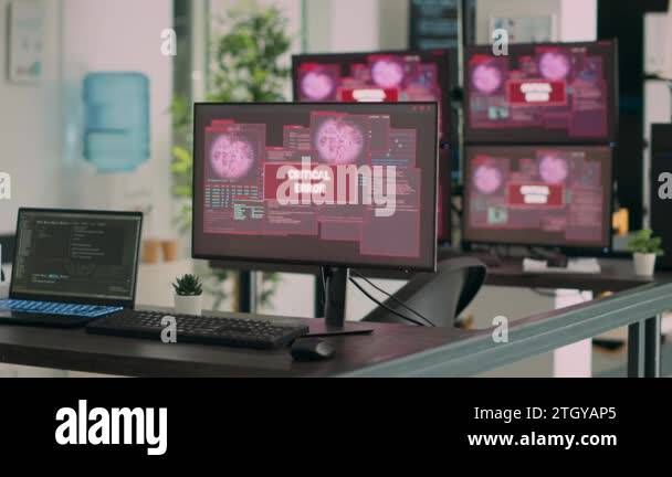 Empty It Office Desk With Multiple Computers Showing Security Breach