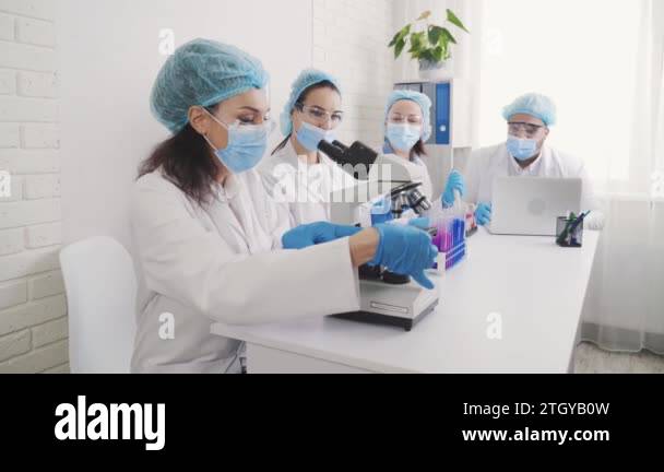 People looking under microscope Stock Videos & Footage - HD and 4K ...