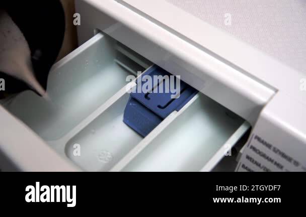 Washing powder. Chemical detergent drawer. Colored granules of washing ...