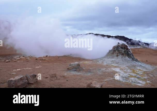 Steam emitting from fumarole in geothermal area of Hverir. Sulphur ...