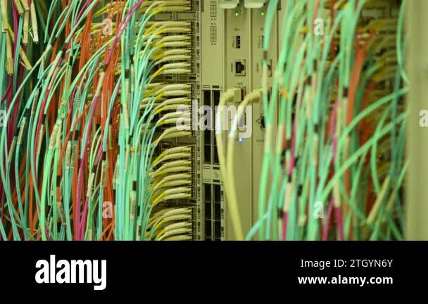 blinking LED lights in a server rack with RJ45 and fiber optic cable ...