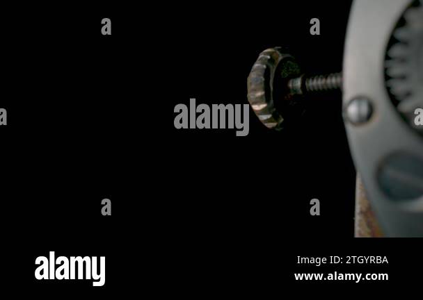 Antique pocket watch mechanism moving on isolated black studio ...