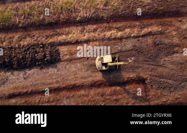Excavator dig ground at construction site. Aerial view of a wheel ...