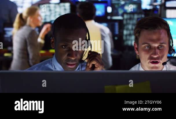 surveillance team working in control room Stock Video Footage - Alamy