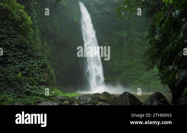 Amazing Nungnung waterfall, slow motioned falling water hitting water ...