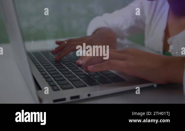 Animation of lines and connections over hands of asian girl typing on ...