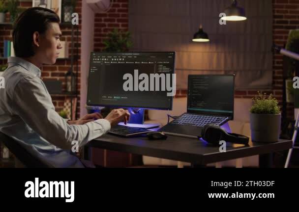 Male Programmer Coding Encryption On Security Software Using Binary Code And Programming