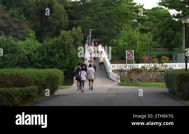 People walking at Changi Point Bridge, Changi Beach Park in Singapore ...