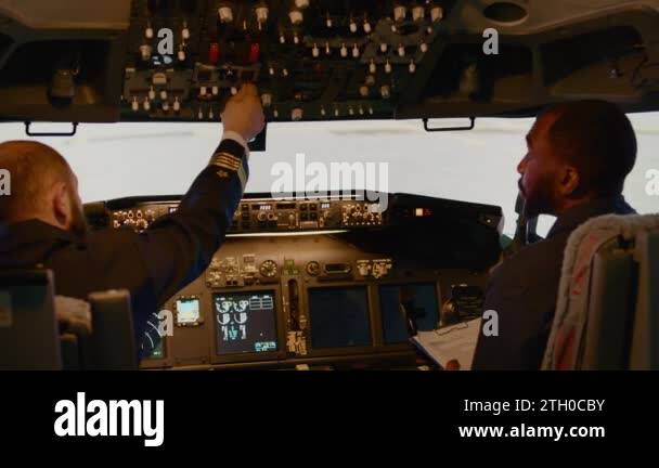 Team of diverse captain and copilot preparing to takeoff with airplane ...