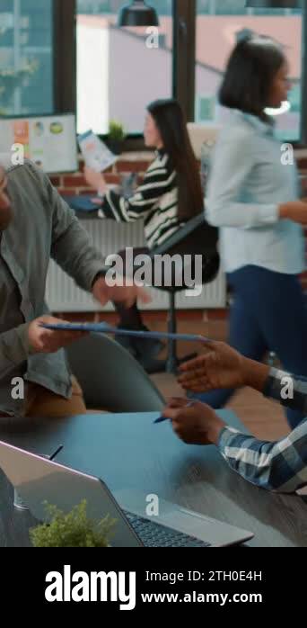 Vertical video: African american recruiter greeting applicant at job ...