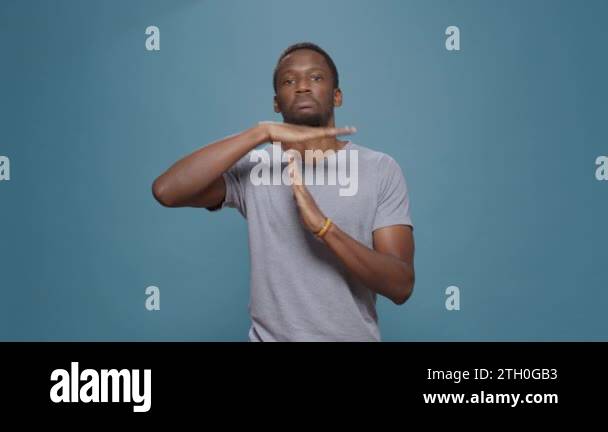 African american man doing timeout gesture with t shape hands ...