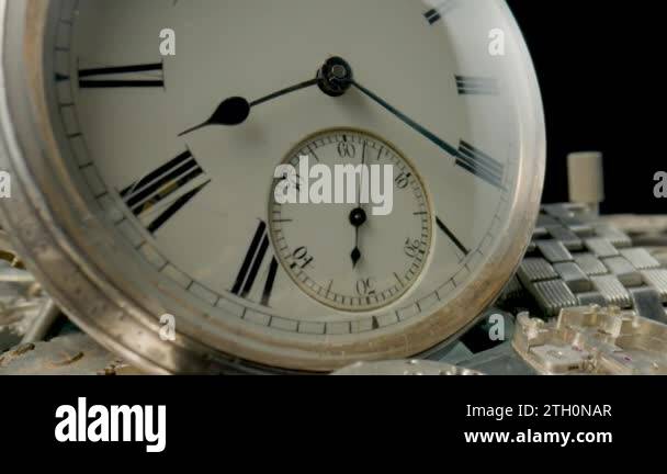 Silver vintage pocket watch dial on pile of clockwork parts. Round old ...