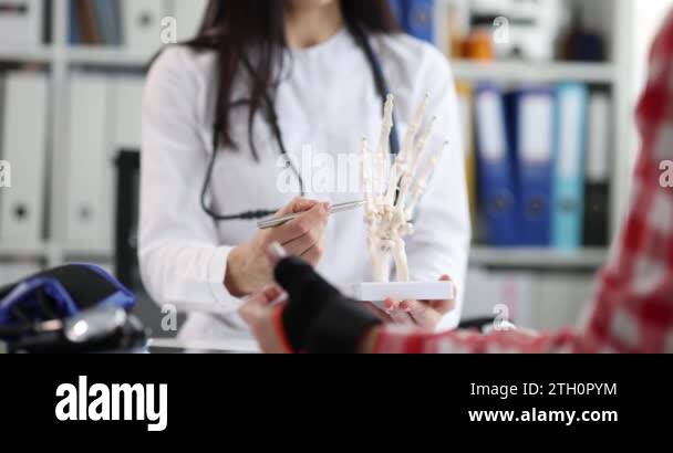 Patient with sprained hands at reception of traumatologist in clinic ...