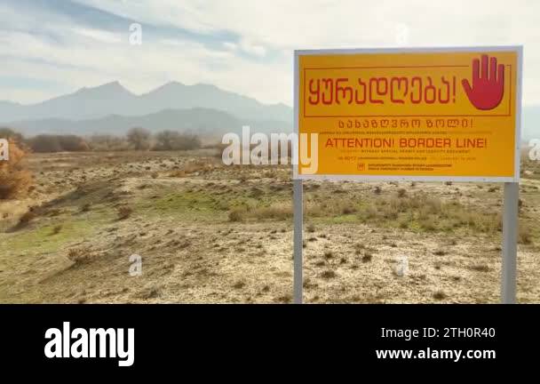 Warning signpost about border line zone between Azerbaijan and Georgia ...
