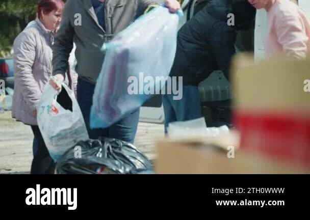 ROME, ITALY - MARCH 10, 2022: Volunteers and activists gathering things of basic necessities for ...