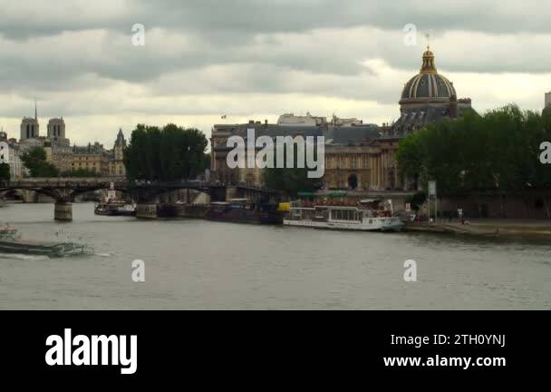 Time-lapse showing the Bibliotheque Mazarine, a ferry going up the ...
