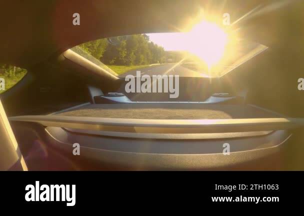 CLOSE UP, LENS FLARE: Golden autumn evening sunbeams shine through the ...