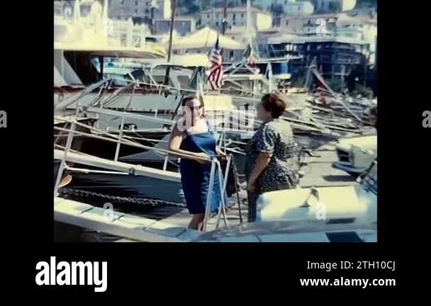 Rome, Italy June 15 1960:women at the port with moored boats from the ...