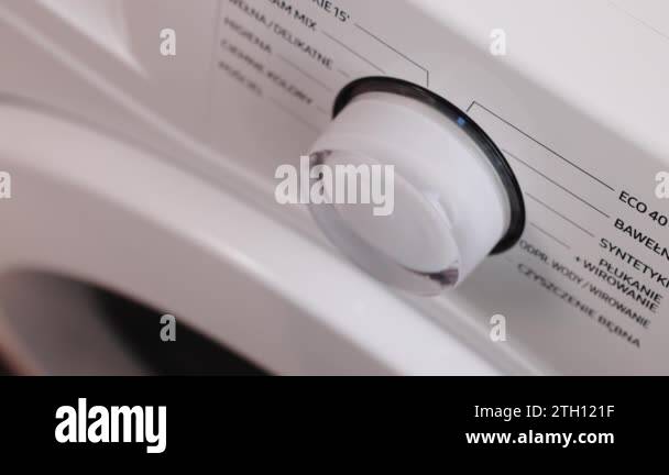 Close Up Shooting with a Hand Rotating the Front Panel Button ...