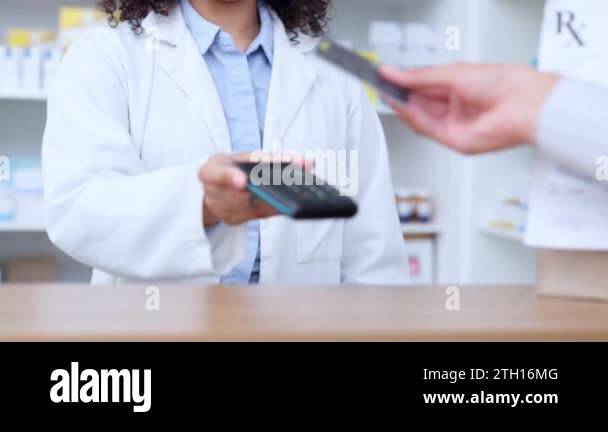 Customer paying with card for prescription medicine in a pharmacy ...