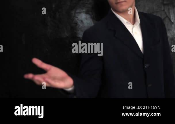 A young businessman doing thinking gesture expression on black ...