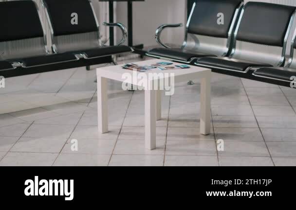Hospital reception waiting area filled with seats, health center clinic used by patients and ...