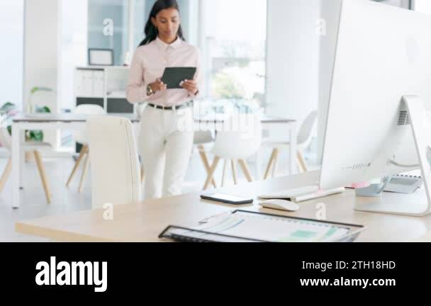 Female secretary browsing online and typing an email on a desktop ...