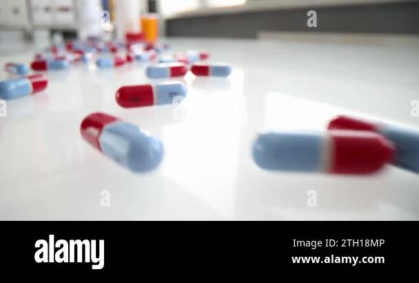 Medicinal tablets pill capsules are scattered on table. Uncontrolled ...