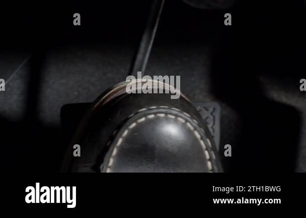 Accelerate and Brake. Foot pressing foot pedal of a car to drive ahead ...