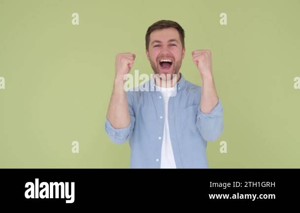 An explosion of positive emotions of a young student. The young man ...