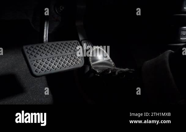 Accelerate and Brake. Foot pressing foot pedal of a car to drive ahead ...