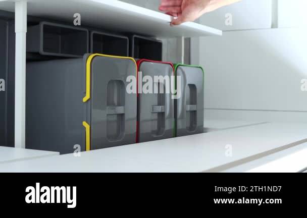 Colorful bins for sorting of plastic, paper garbage and organic waste ...