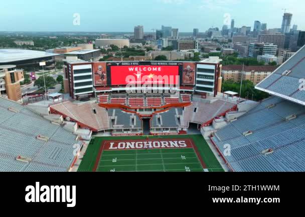 Texas Longhorns football stadium at UT Austin. Aerial reveal of skyline ...