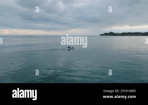 Puerto Viejo, Costa Rica - August 2022: Man paddling a one person kayak ...