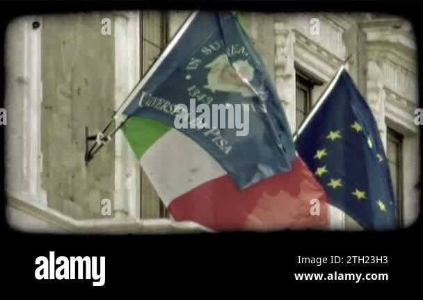Static shot of flags on the facade of the University of Pisa building ...