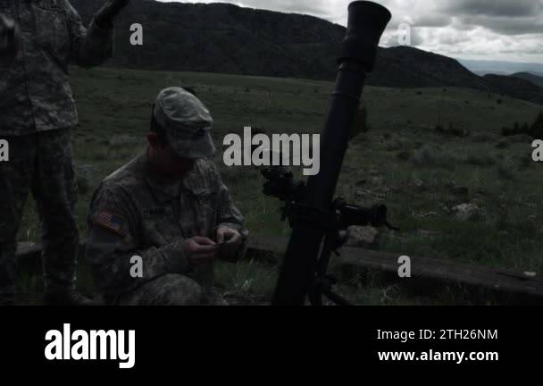 Slow motion shot of soldier adjusting mortar launcher. Green Beret ...