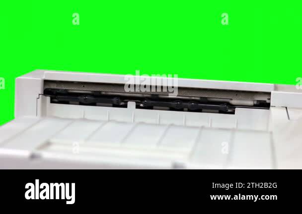 Printing documents paper withe laser print machine on green screen ...