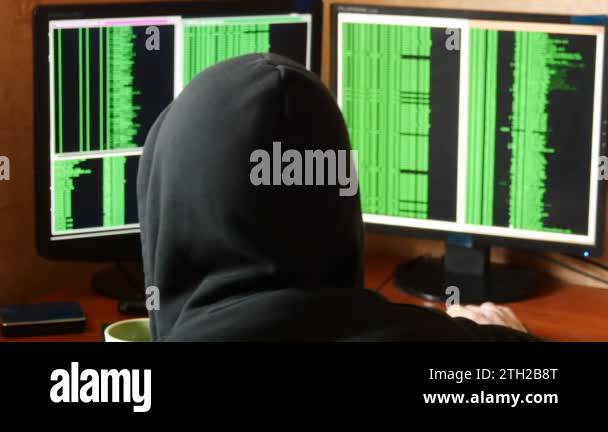 Hacker breaking code and drinking from the cup at your desk. Criminal ...
