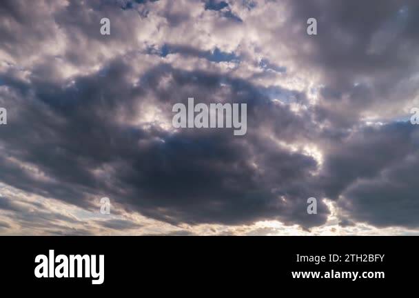 Clouds in the blue sky slowly move and change shape, Timelapse. Layered ...