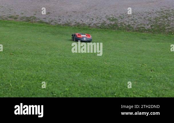 Green electric robotic lawnmower Stock Videos & Footage - HD and 4K ...