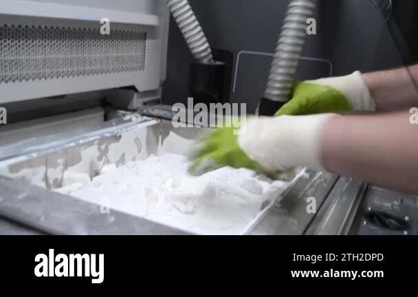 Engineer or artist designer printing 3D parts and shaping models from ...