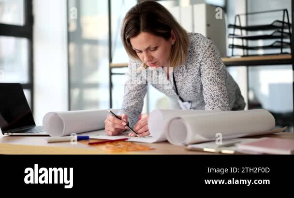 Woman architect draws sketch of reconstruction of building. House ...