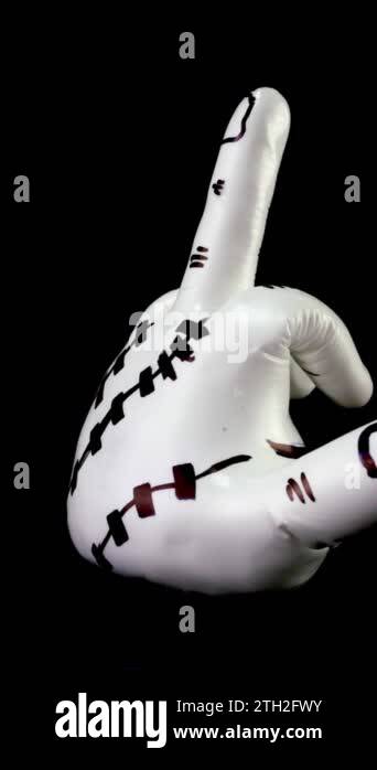 White sculpture in shape of hand showing obscene gesture rotates ...