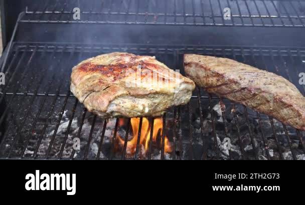 This is a typical American food with grilled beef steaks and pork ribs ...