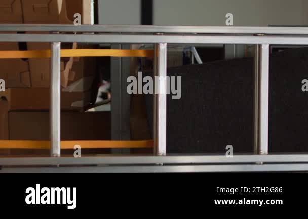 Vertical video: Empty office space in warehouse with carton boxes, desk ...