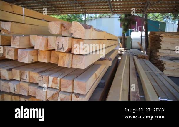 Wood warehouse. Sliced wooden boards are stored in a trading warehouse ...