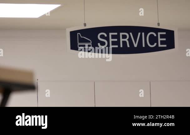 Motion of service sign hanging up the roof inside sears store with 4k ...
