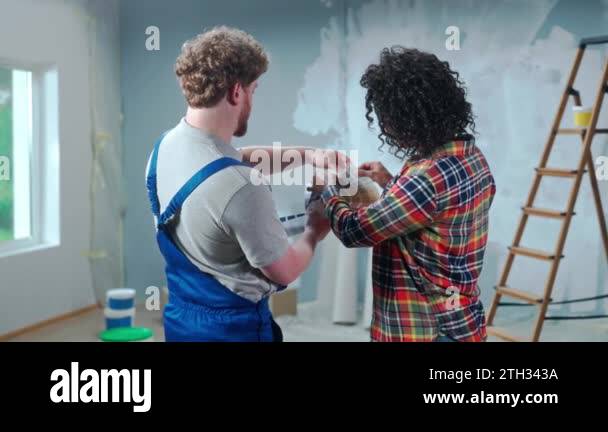 Customer is an African American woman and white male foreman choosing ...