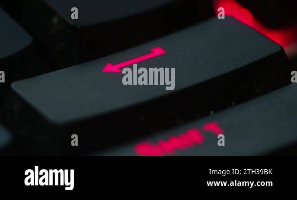 Close up of person pressing enter button on keyboard repeatedly. Red ...