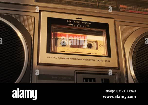 Audio cassette playback in vintage tape recorder. Record player playing ...